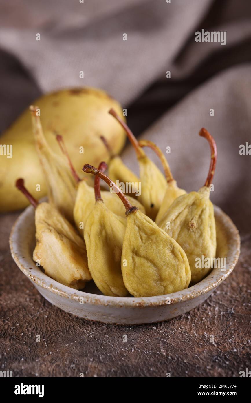 dried fruits organic pears on the table, rustic style Stock Photo - Alamy