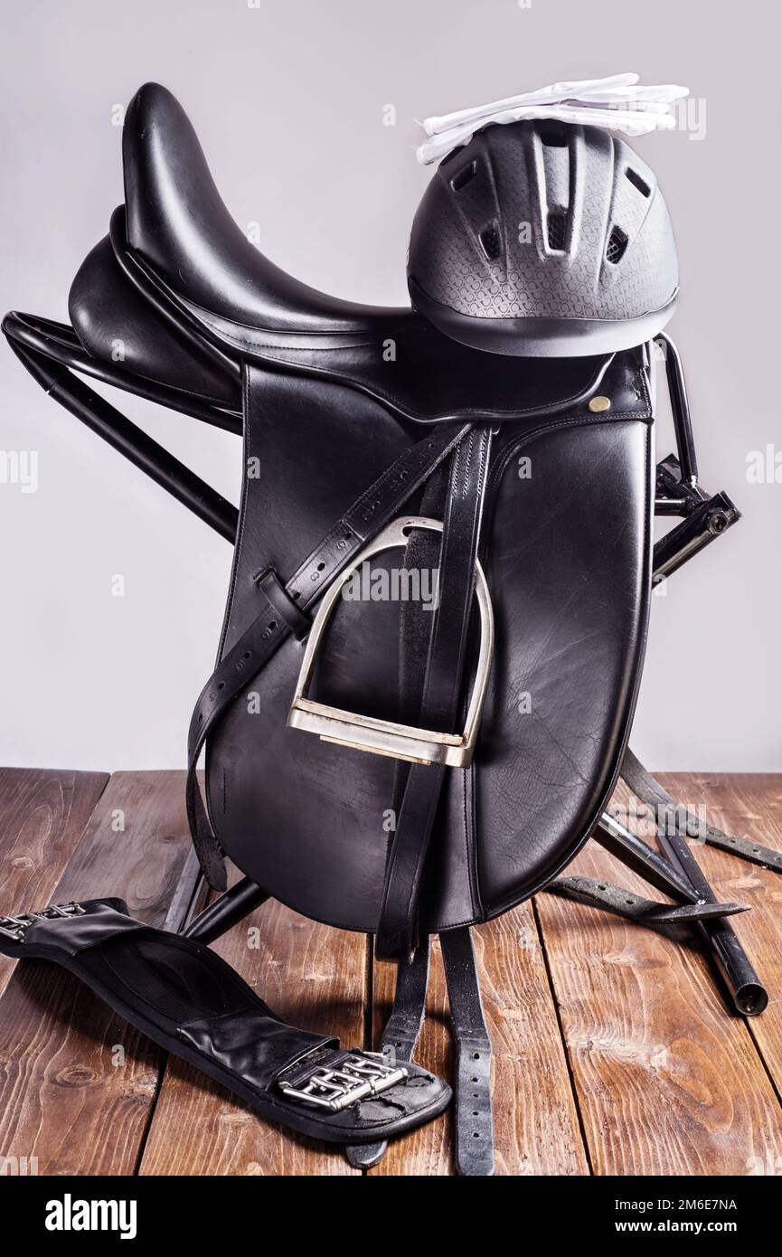 Black professional leather dressage saddle in complete with riding ...