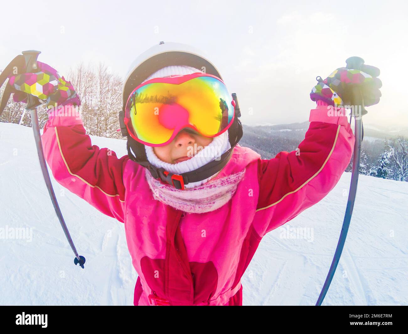 Little girl on ski slope Stock Photo - Alamy
