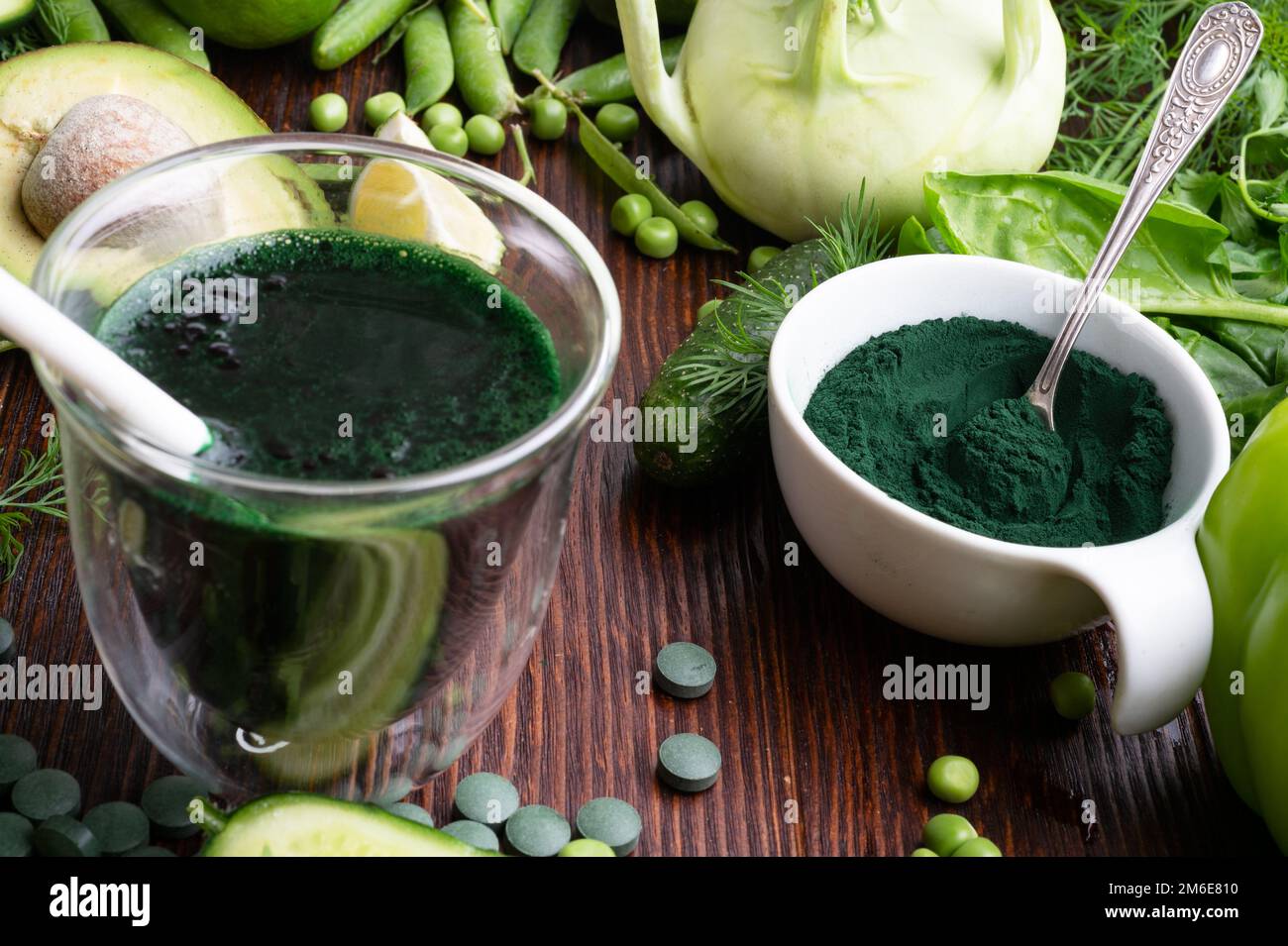 Detox green cocktail with spirulina around vegetables. lifestyle ...