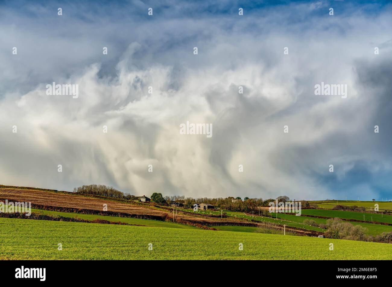 On a beautiful day a squally shower appears in the blue sky on the ...
