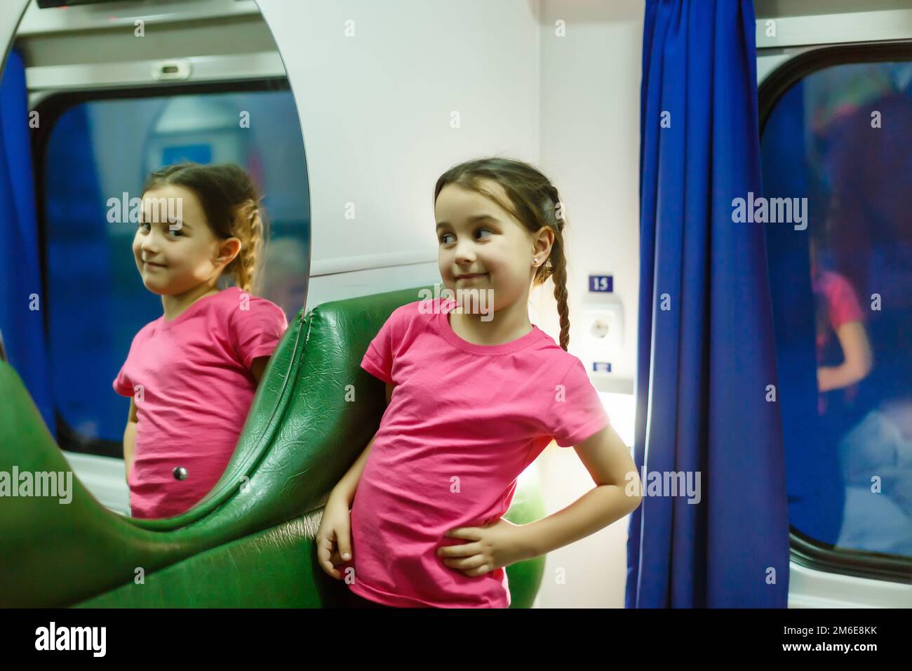Child traveling by train. Little kid in a high speed express train on ...
