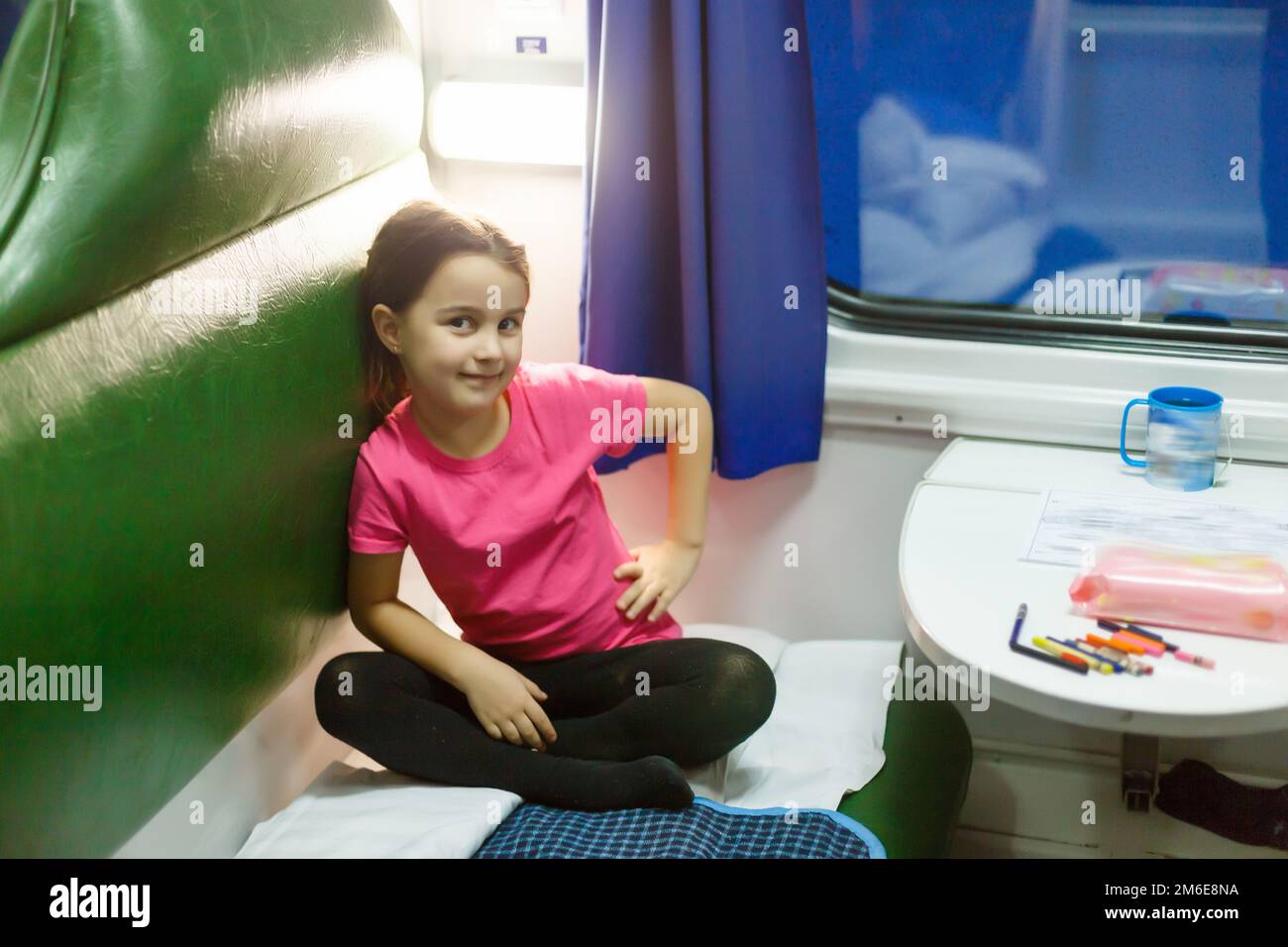 Child traveling by train. Little kid in a high speed express train on ...