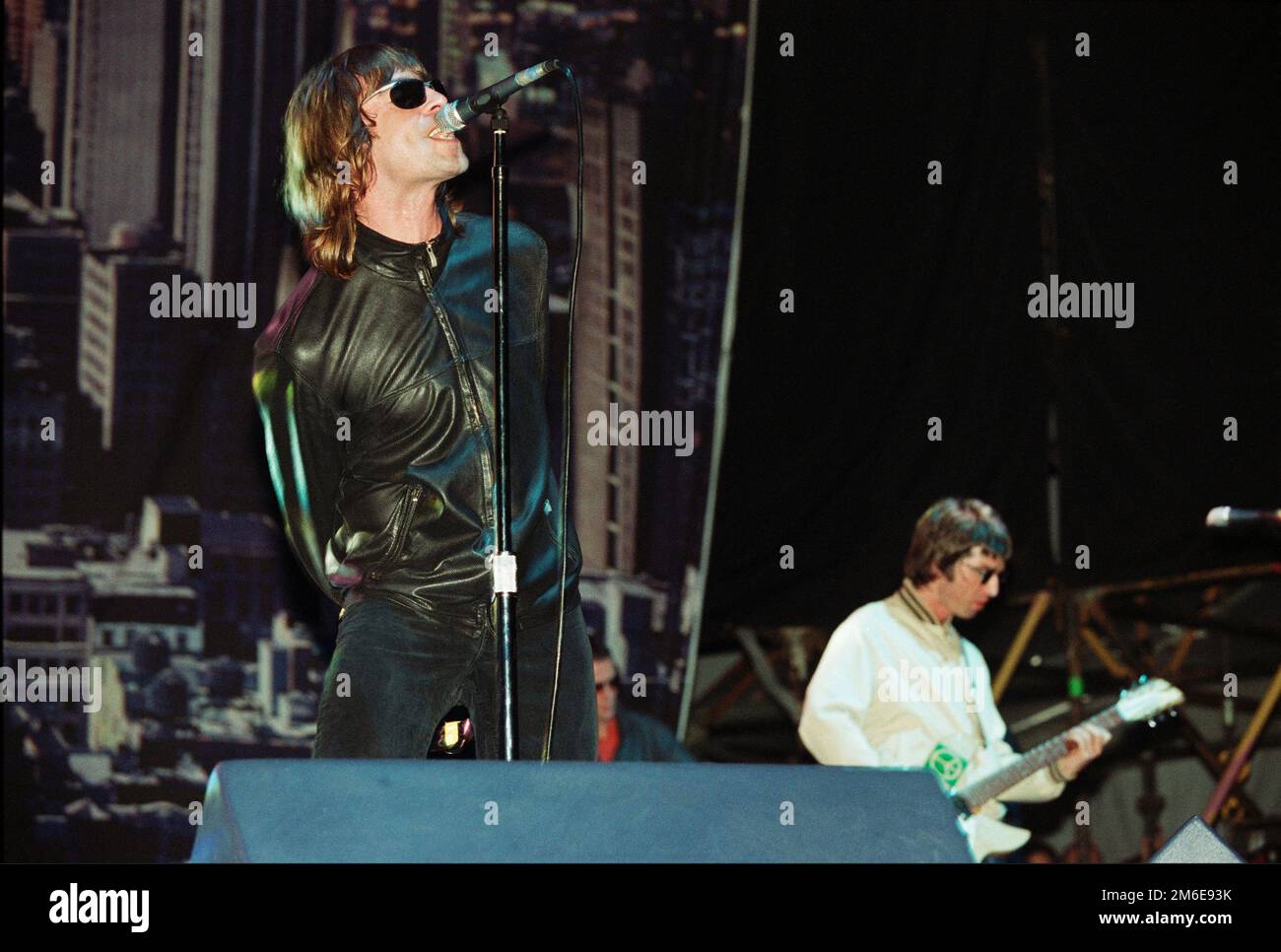 OASIS vocalist and frontman Liam Gallagher together with his brother ...