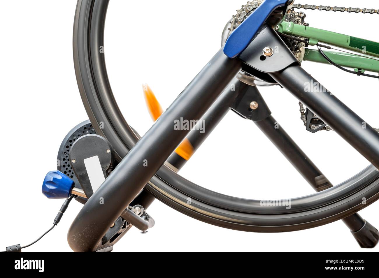 Roller trainer with road bike clamped in front of white background ...