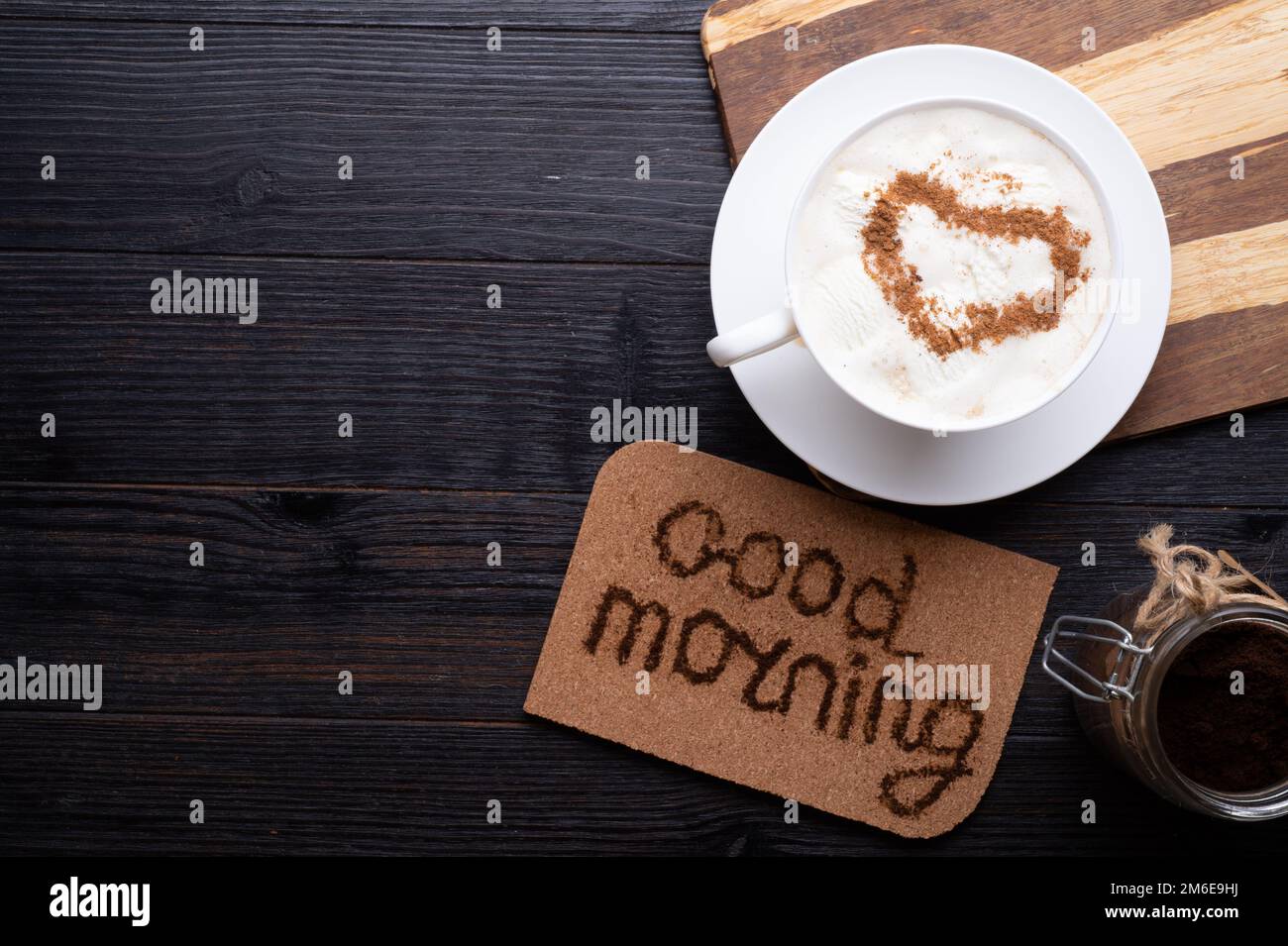 Porcelain cup of coffee with ice cream and cinnamon heart served at ...