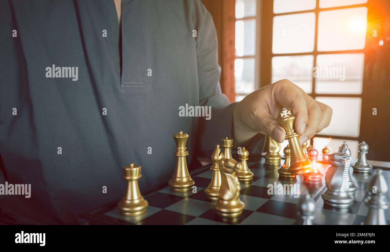 Concentrated businessman developing chess gambit, strategy ,playing ...
