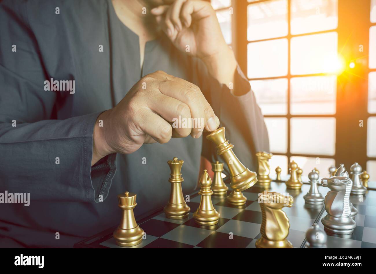 Concentrated businessman developing chess gambit, strategy ,playing ...