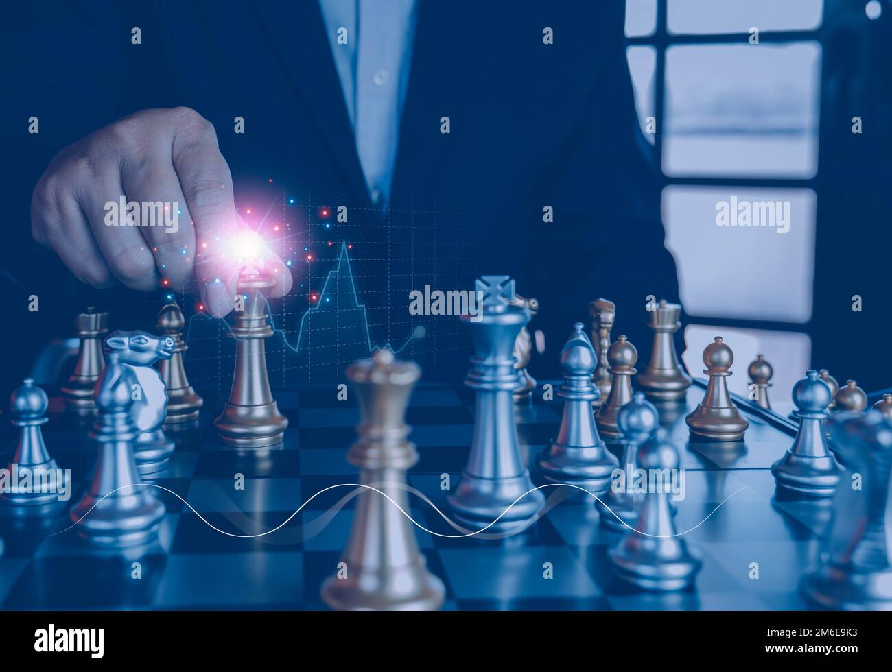Hand of businessman holding gold king chess on stock market or forex ...