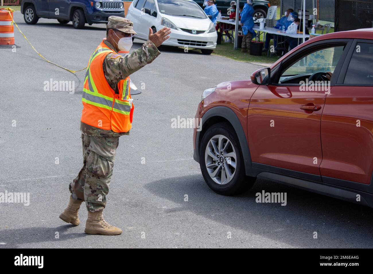 Cpl. Raymond Rodríguez of the Puerto Rico State Guard directs a citizen ...