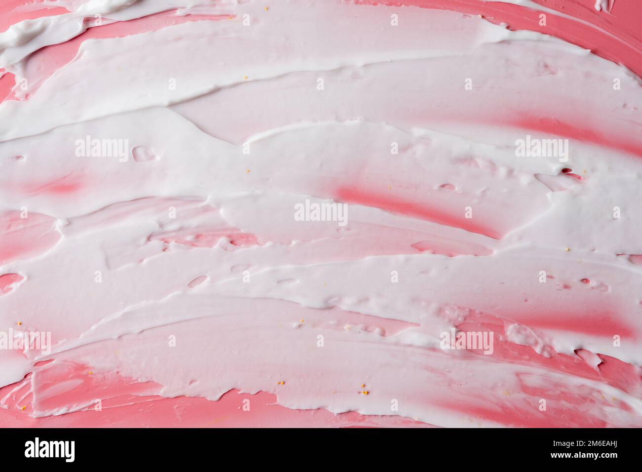 White facial cream smears on pink background. Surface covered by cream ...