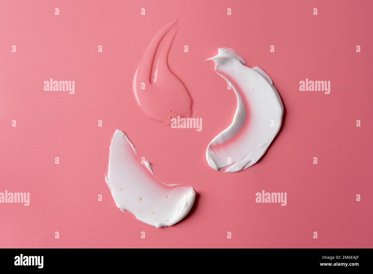 Set of different white and transparent cream smears on pink Stock Photo ...