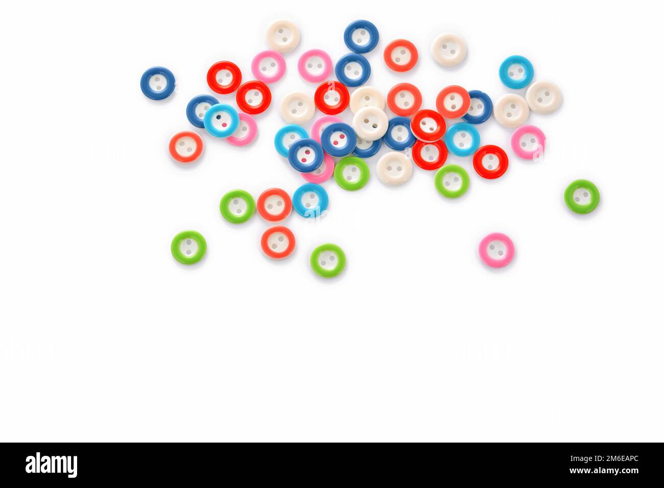 Pile of colorful buttons on white background Stock Photo - Alamy
