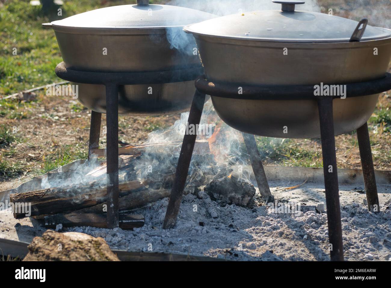 Kitchen outdoors, cooking at the stake, metal cauldron on the fire ...