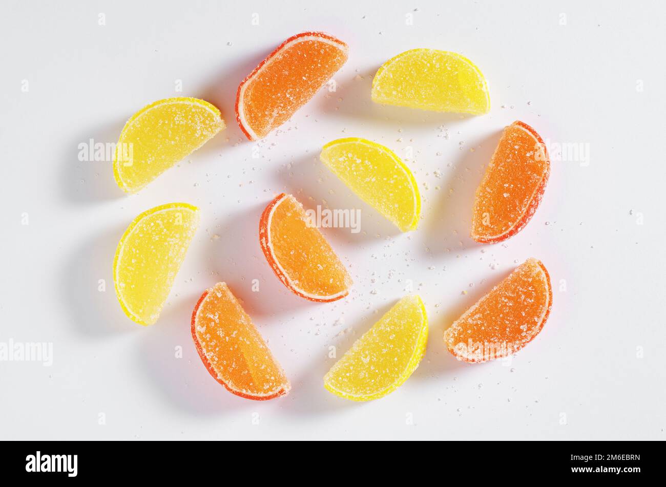 Marmalade in the form of lemon and orange slices on a white background ...