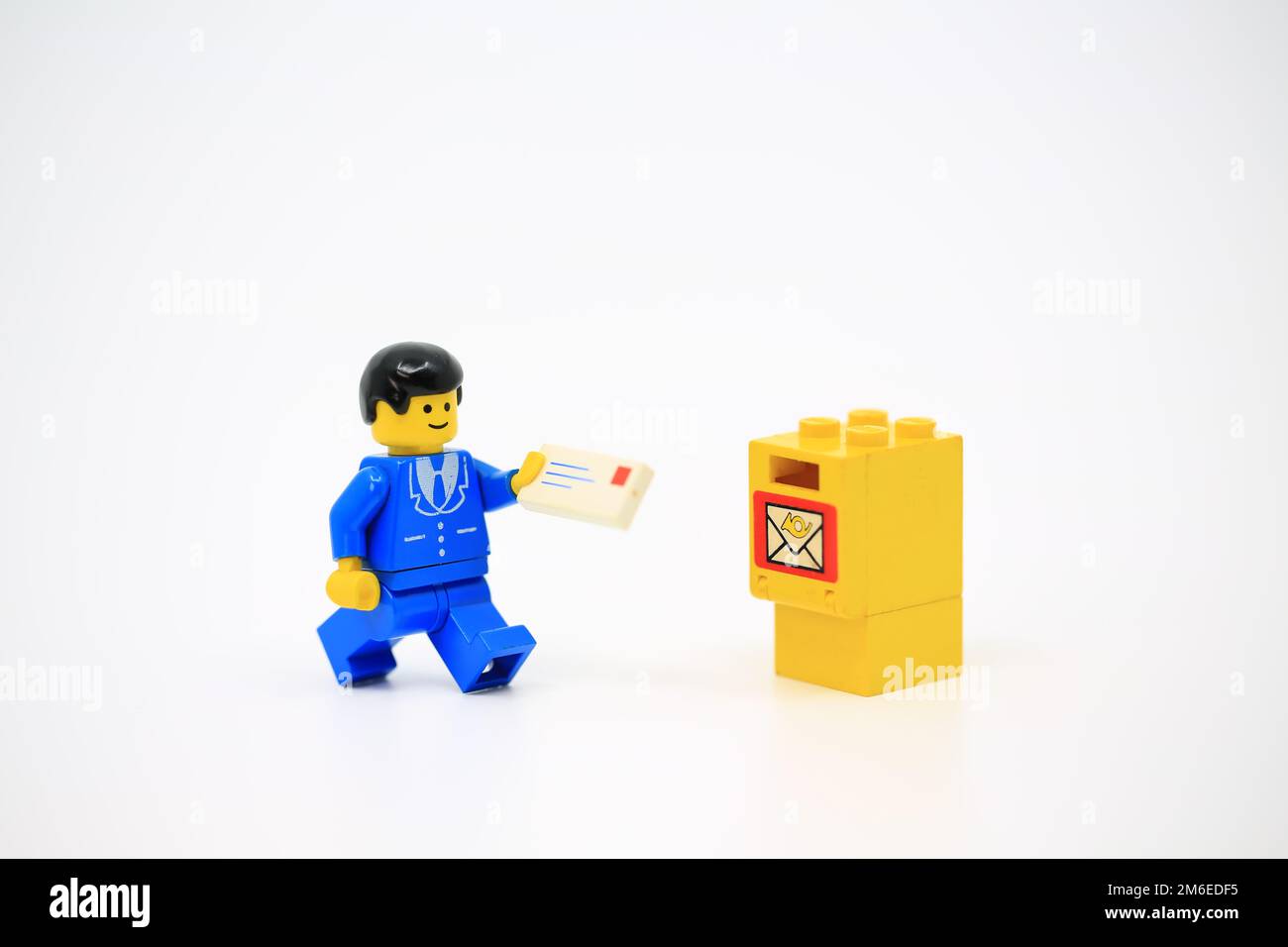 worker send letter to mailbox Stock Photo - Alamy