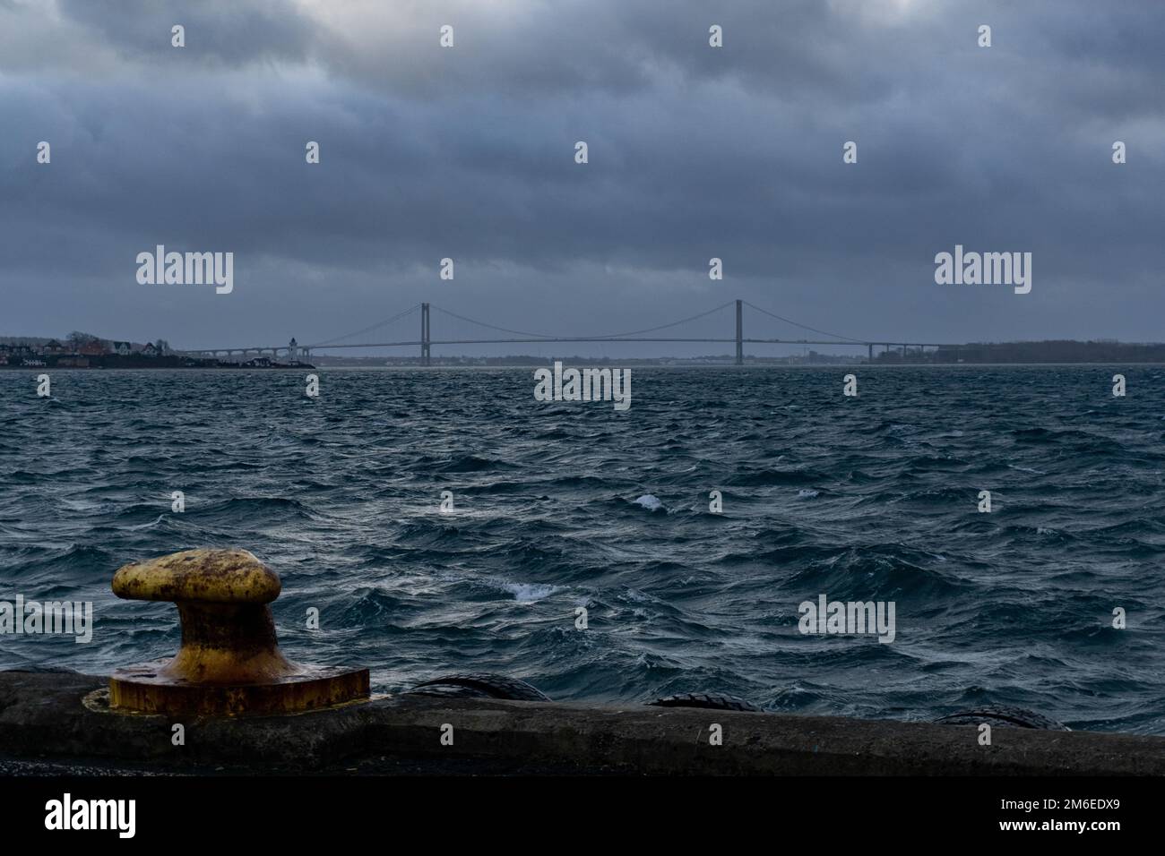 A view of the blue water from an industrial ship near the pier of ...