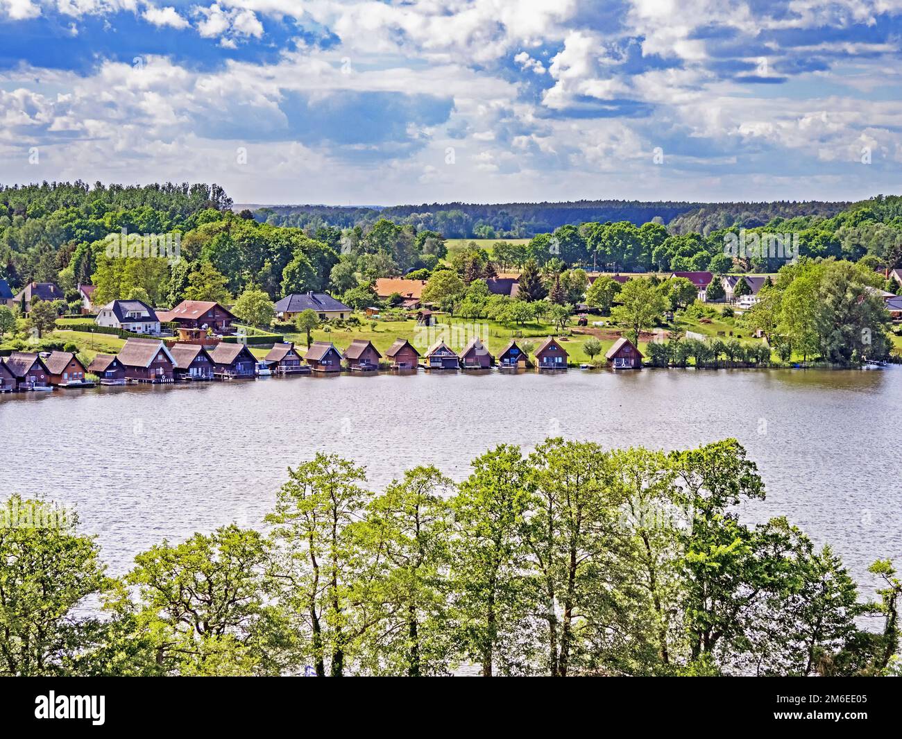 Aerial view of Mirower See with boathouses on the shore, Mecklenburg ...