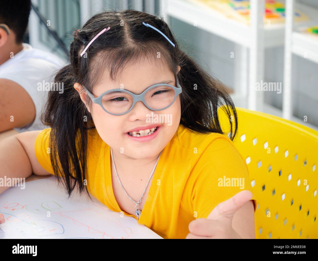 A cheerful group creative arts class for kids and their teacher in the ...