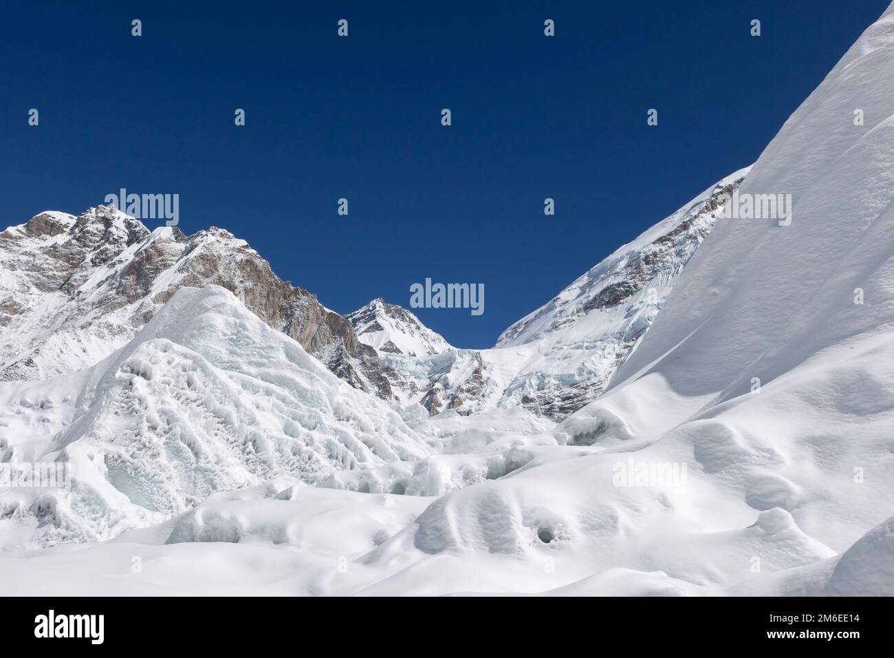 Beautiful snowdrift and ice covered mountains view up to the peaks and ...