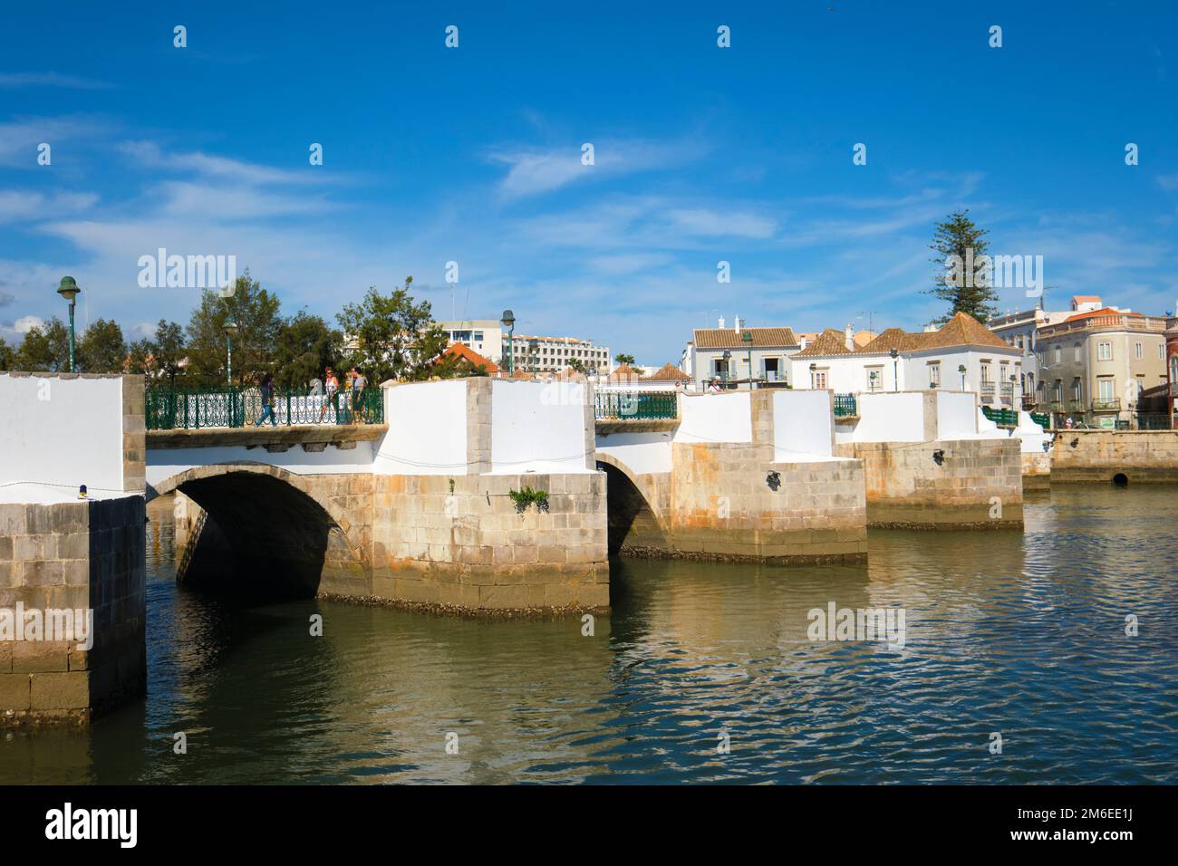 A view of the historic, arched Roman bridge, Ponte antiga de Tavira ...