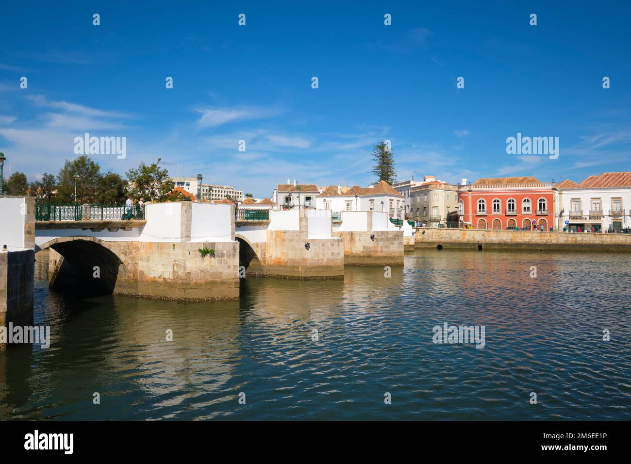 A view of the historic, arched Roman bridge, Ponte antiga de Tavira ...
