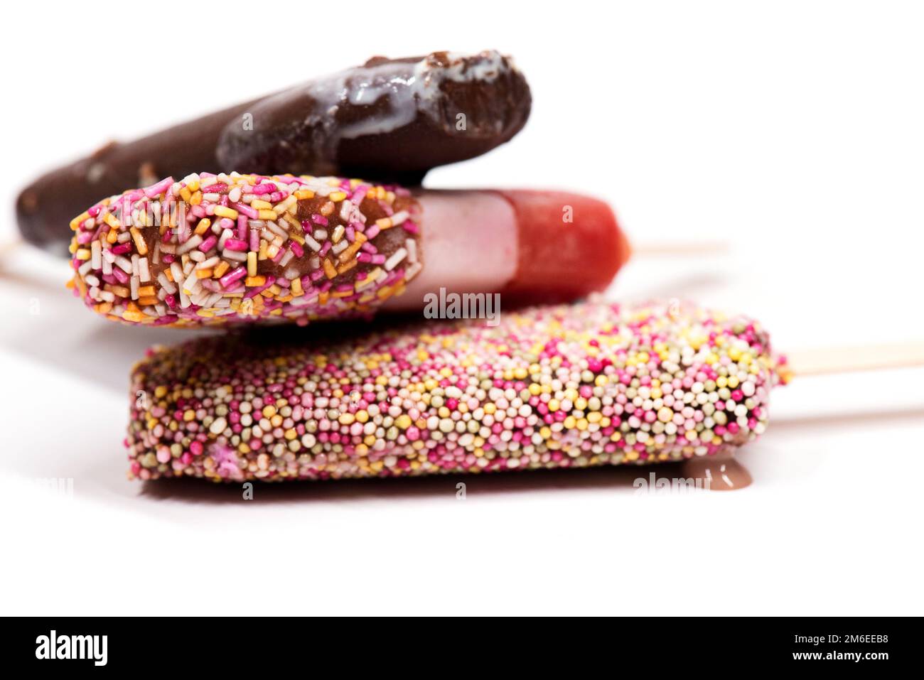 Ice cream on stick with sprinkles Cut Out Stock Images & Pictures - Alamy