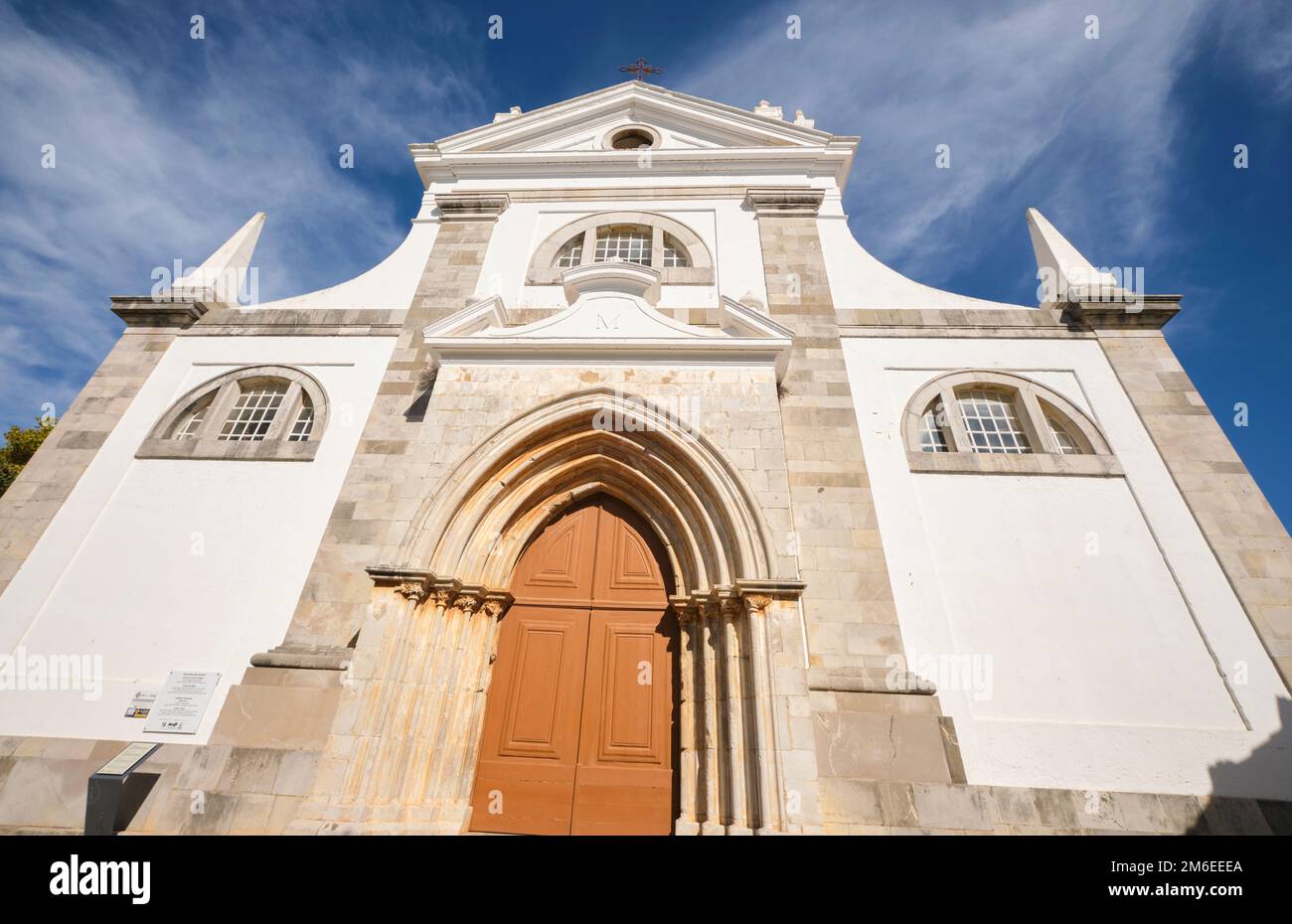A view of the whitewashed, stucco facade of the old church, Igreja de ...