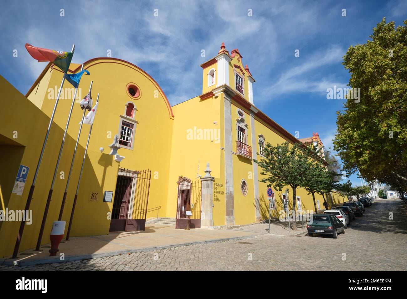 Exterior view of the yellow, restored Pousada Convento Tavira, now a ...