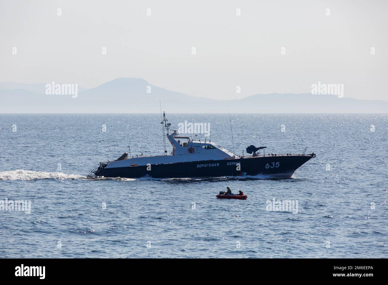 A Coast Guard boat goes at high speed through the water area of ...