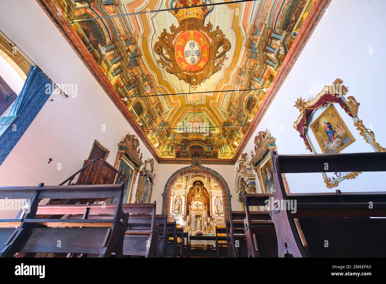 A view of the heavy, gold, rich, wood-carved interior details of the ...