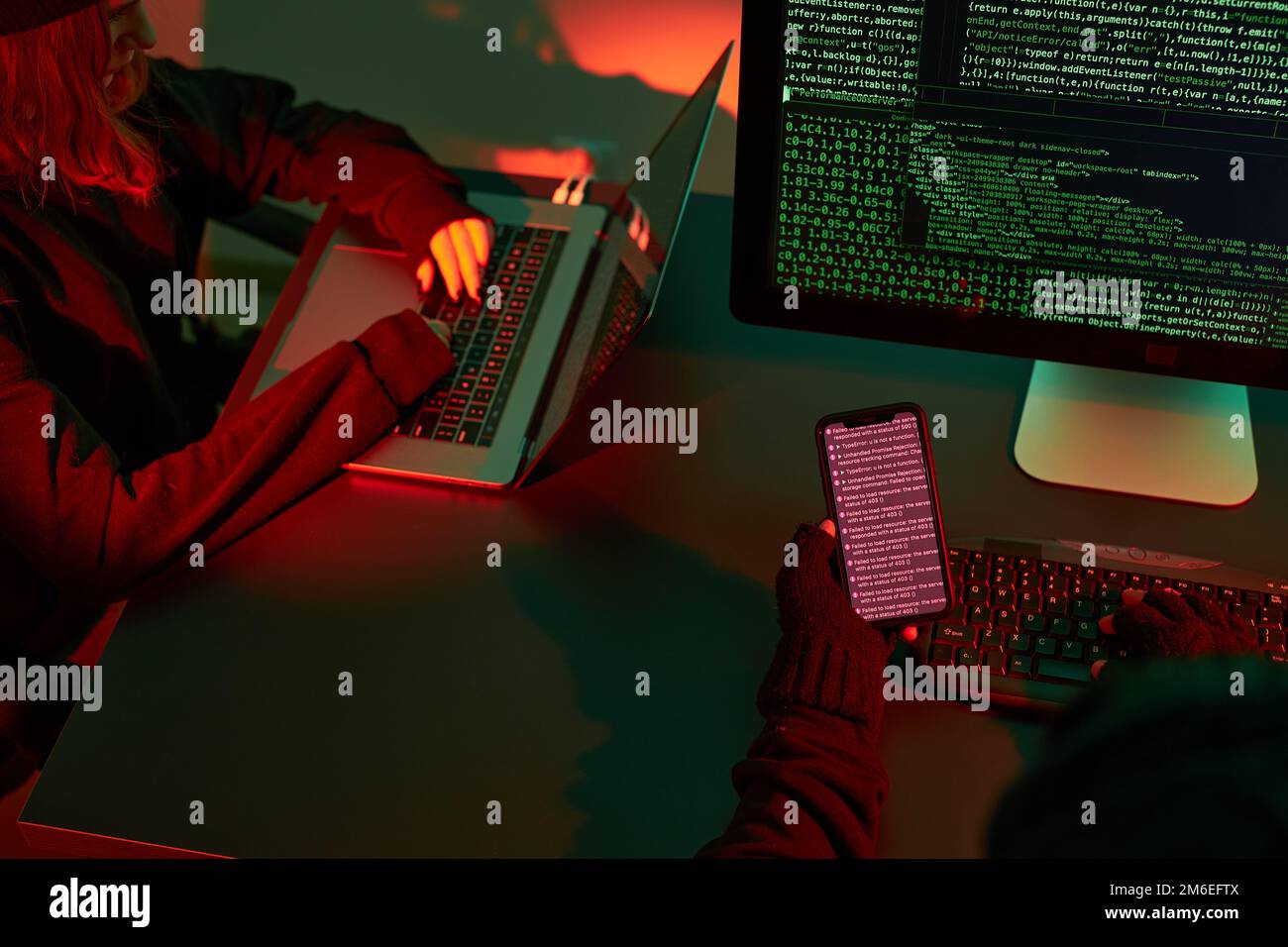 Anonymous People Using Computer And Programming To Break Code Cyber