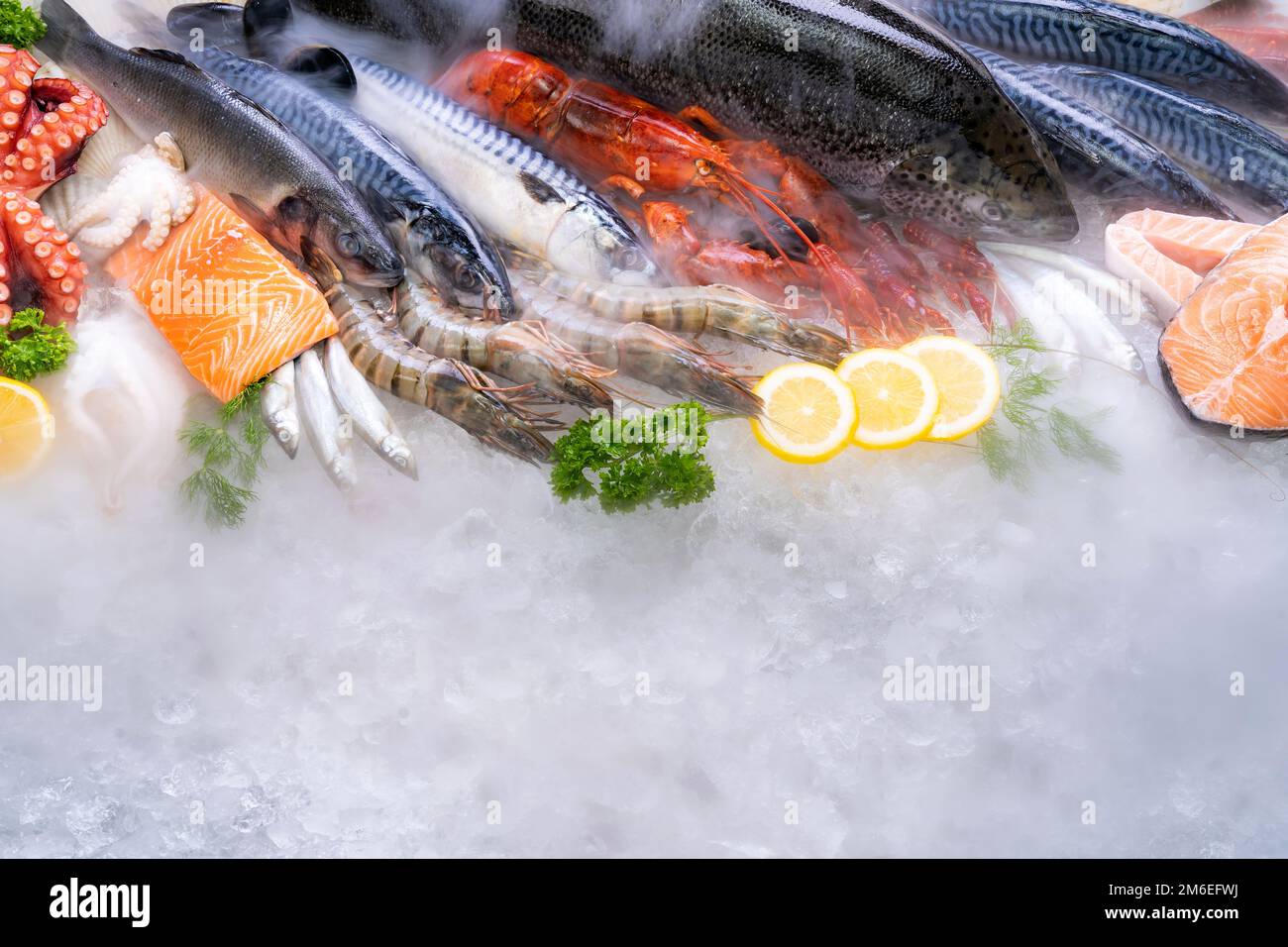 Fresh seafood on ice background Stock Photo - Alamy