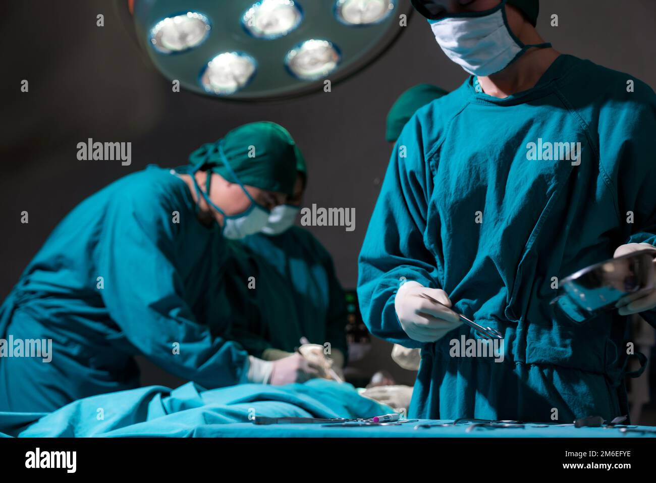 Operating room nurse prepare surgical equipment for surgeon Stock Photo ...