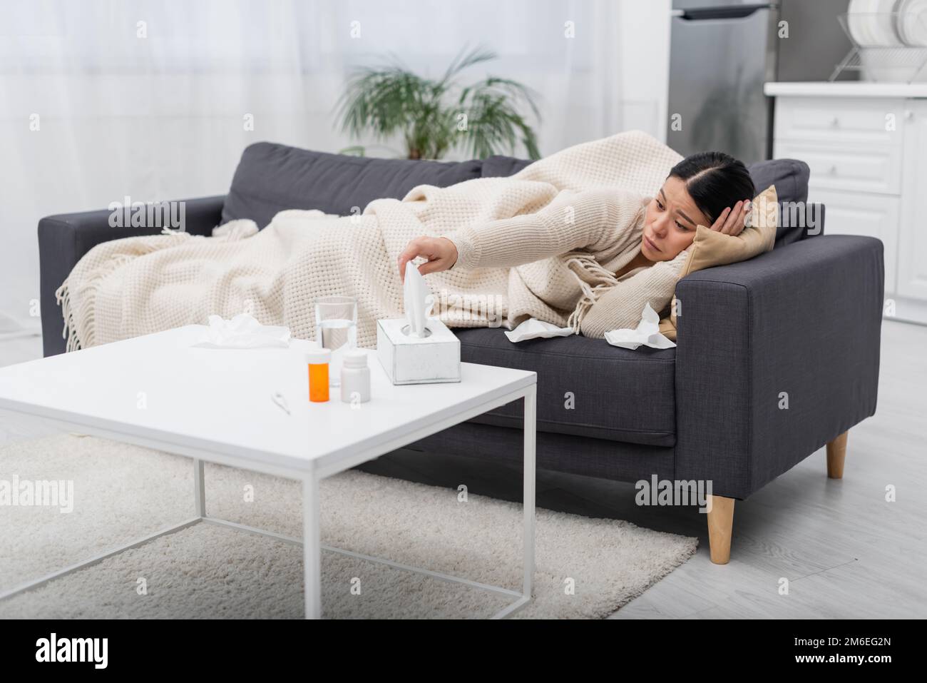 Sick asian thermometer hi-res stock photography and images - Alamy