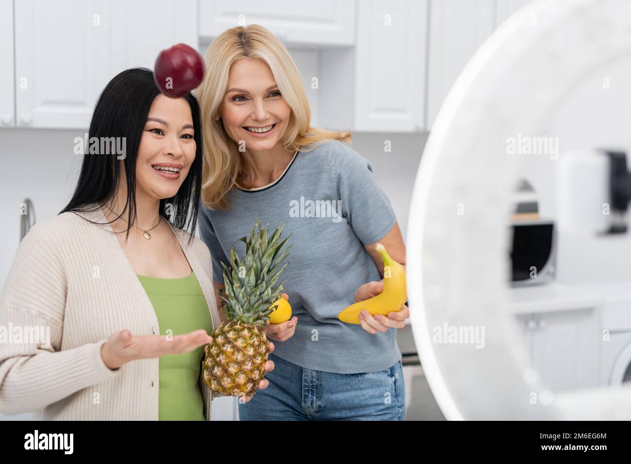 Women throwing fruits hi-res stock photography and images - Alamy