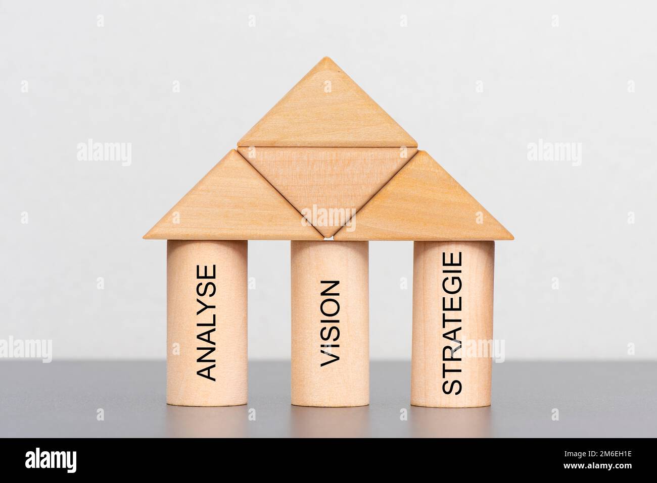 Three pillars with analysis, vision and strategy Stock Photo - Alamy