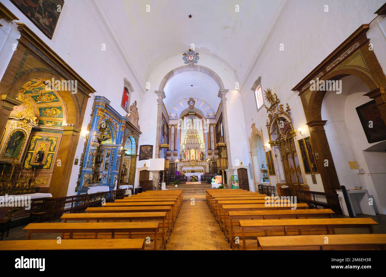 A view of the rich, fancy, gold, Baroque altar. At the Igreja de ...
