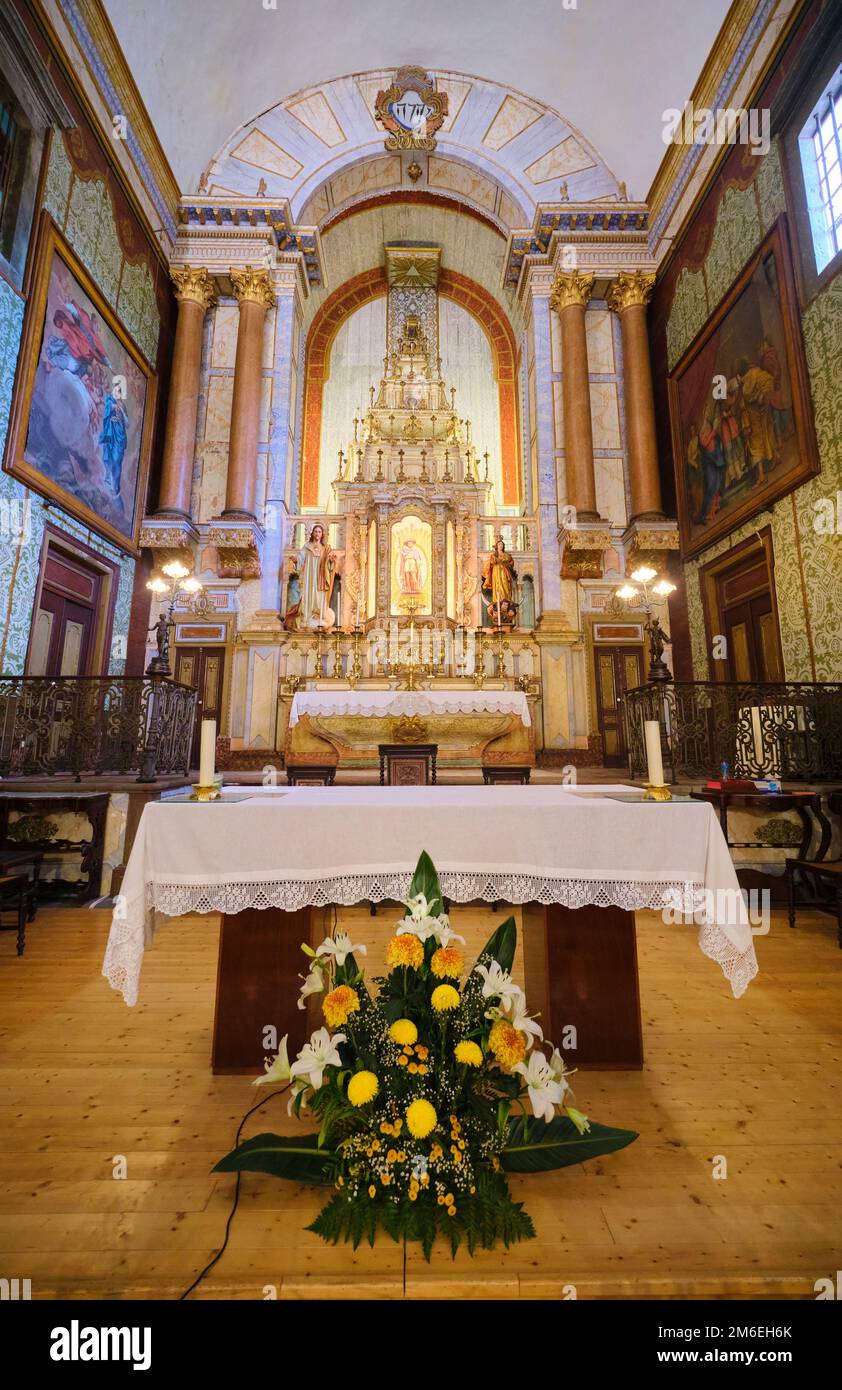 A view of the rich, fancy, gold, Baroque altar. At the Igreja de ...