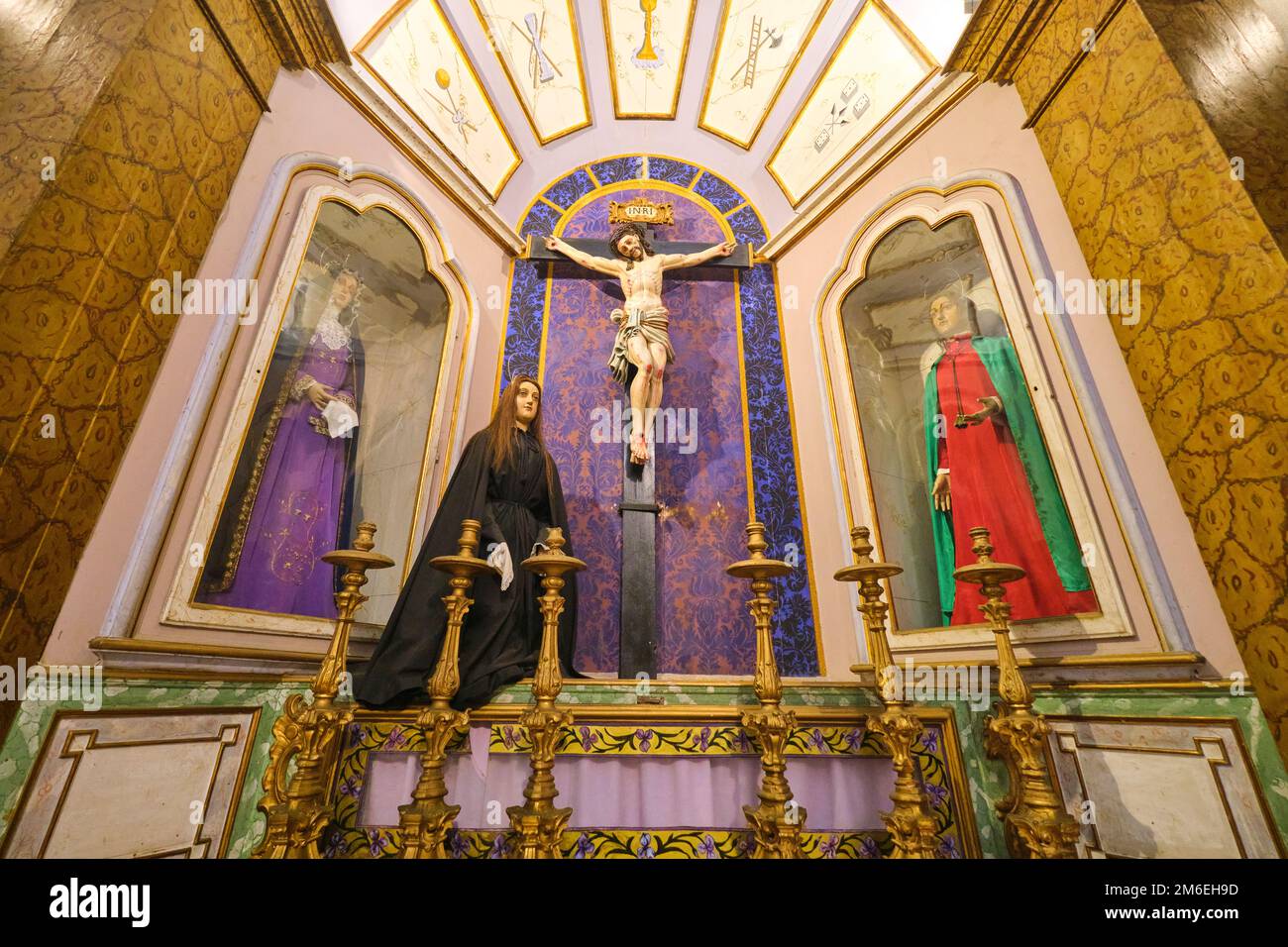 A side alcove scene of Jesus on the cross with women saints, angels. At ...