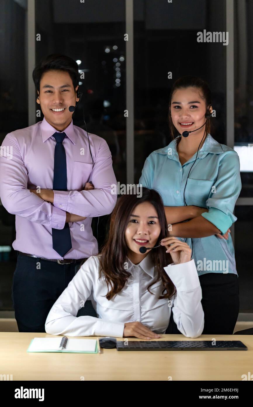 Call center team Portrait at night Stock Photo - Alamy