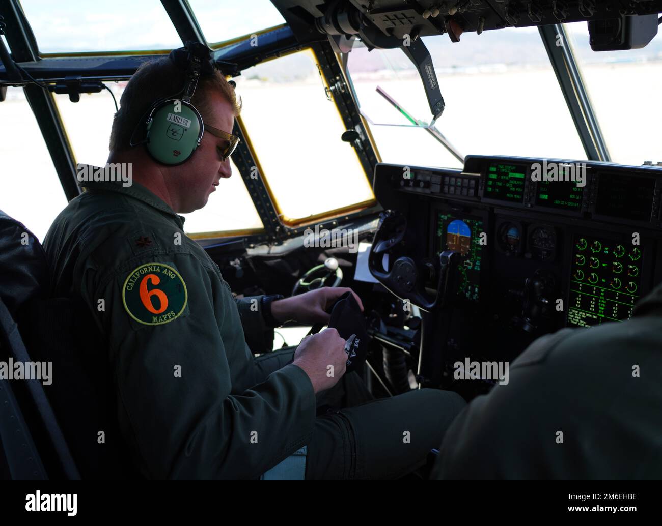 Maj. Ben Vale, a pilot assigned to the 146th Airlift Wing, prepares for ...