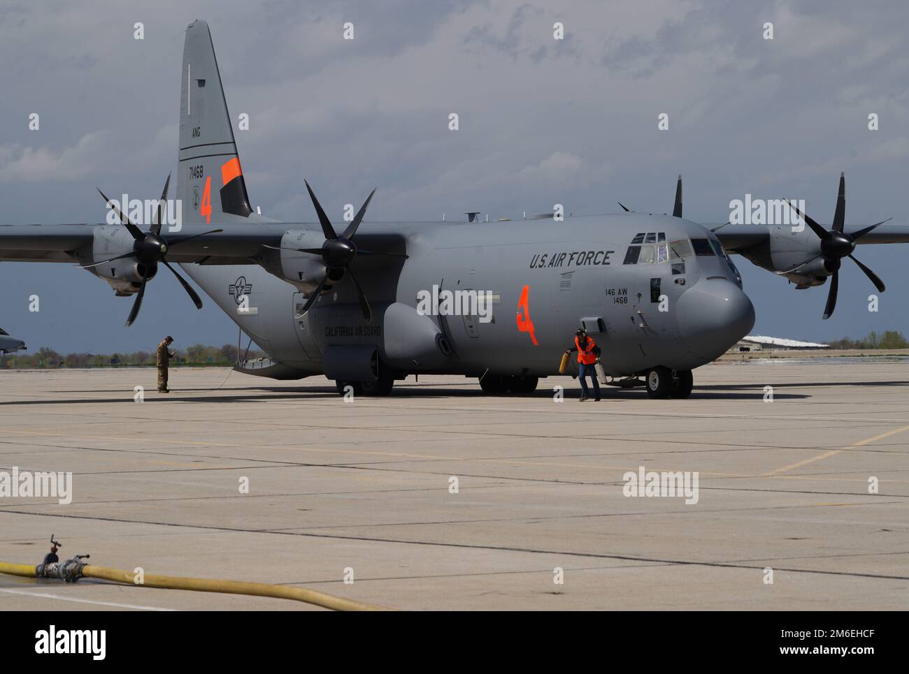 A MAFFS (Modular Airborne Fire Fighting System) equipped C-130 Hercules ...
