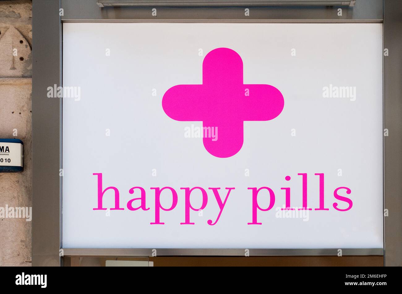 Signboard of candy store Happy Pills in Barcelona Stock Photo - Alamy