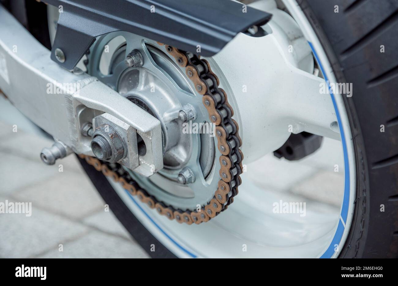 Part of the rear wheel of a motorcycle. Chain on a motorcycle wheel ...
