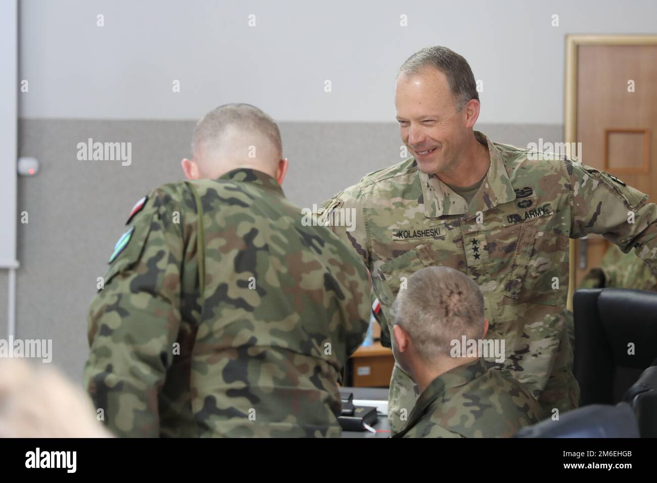 U.S. Army Lt. Gen. John S. Kolasheski, V Corps commanding general, shakes hands with Polish ...