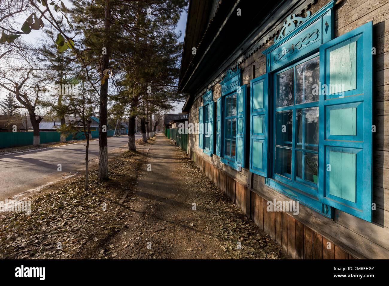An old one-story wooden house with carved shutters in the Russian style ...