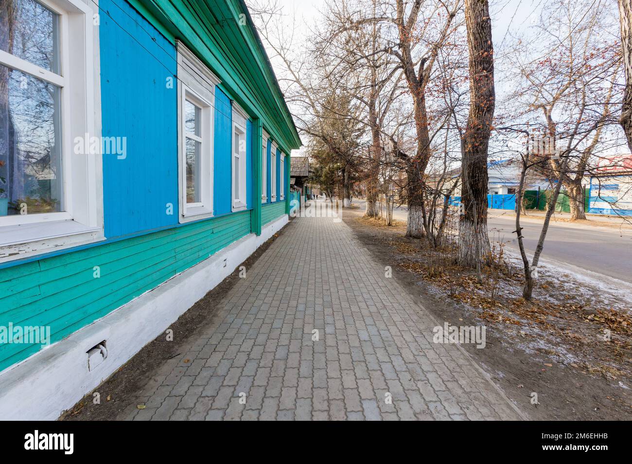 An old one-story wooden house with carved shutters in the Russian style ...