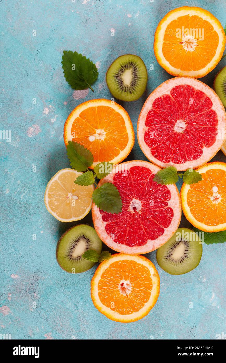 Citrus fruits with orange, lemon, grapefruit and lime on blue ...