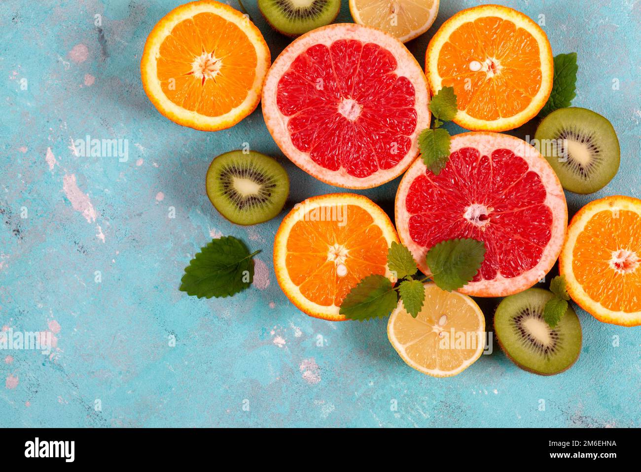 Citrus fruits with orange, lemon, grapefruit and lime on blue ...